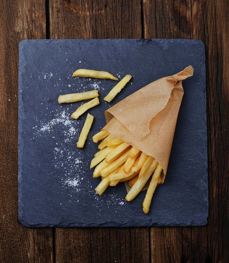 French Fries in Paper Wrapper Stock Image - Image of homemade, potato ...