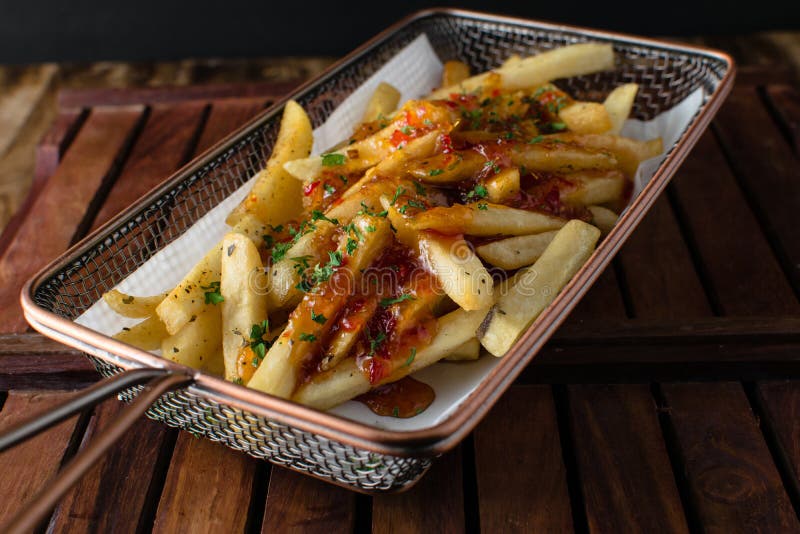 French Fries with Souce Served on the Wodden Table with Spoon Sets ...