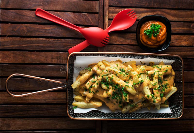 French Fries with Souce Served on the Wodden Table with Spoon Sets ...