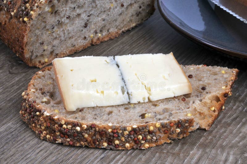 French Morbier Cheese on a Slice of Bread Stock Image - Image of seed ...