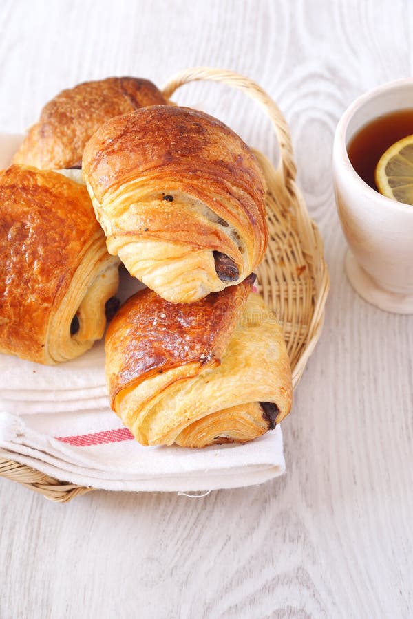 French Puff Pastry: Sweet Chocolate Buns and Cup of Tea Stock Photo ...