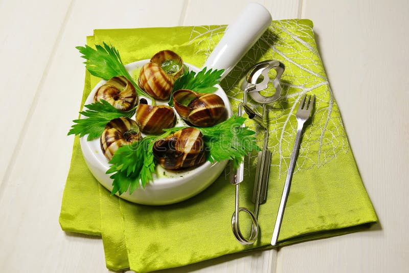 French snails stock image. Image of fork, green, dish - 49920621