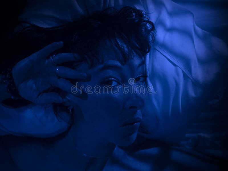 A French Woman Lying on a Bed Under Blue Light, Moonlight Shining ...