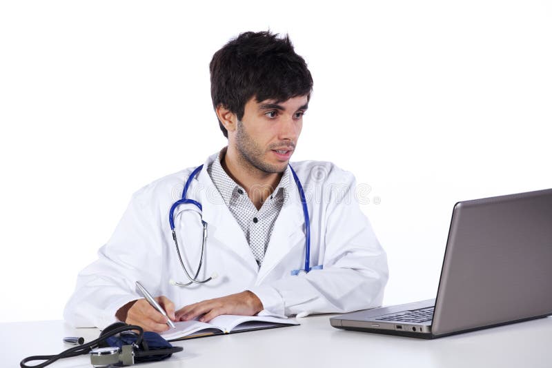 Doctor in Scrubs Using Computer at Hospital Desk Stock Image - Image of ...
