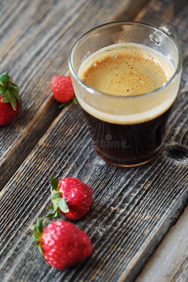 Fresh Americano Coffee and Strawberries on the Table Stock Photo ...