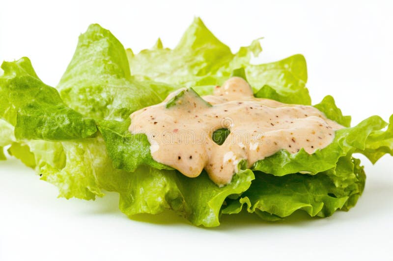 Fresh and Appetizing Caesar Dressing Drizzled on Crisp Lettuce Leaves ...