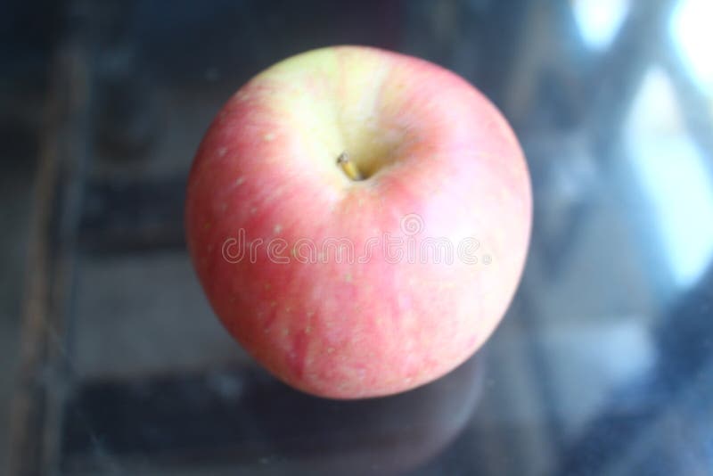 A Fresh Apple on a Mirror Table Stock Image - Image of green, grow ...