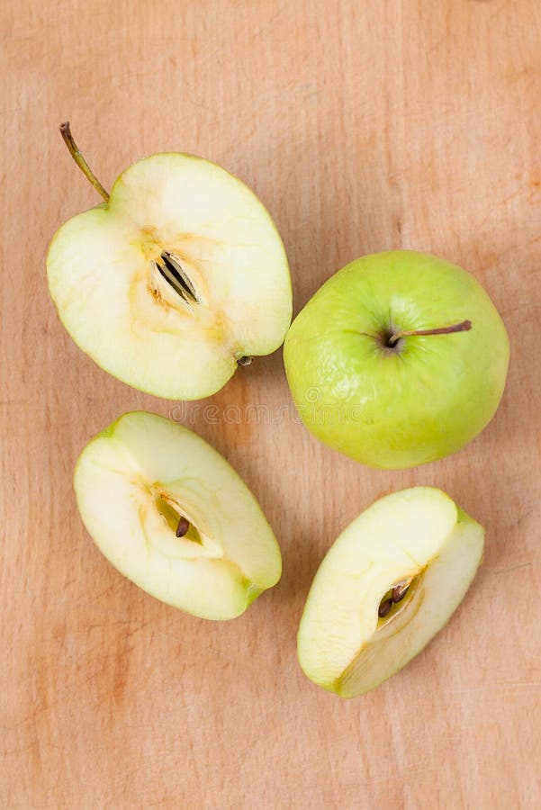 Cut apples on board stock photo. Image of segment, yellow - 11020528