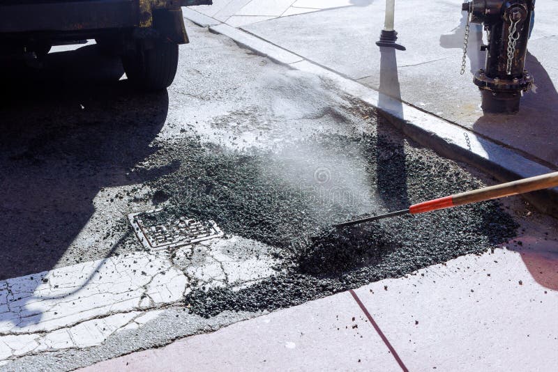Fresh Asphalt Construction Resurfacing a Bad Road in City Stock Image ...
