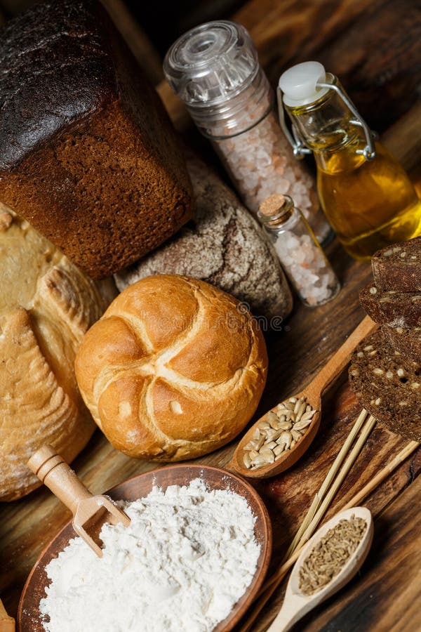 Fresh Assorted Loaves of Gluten-free Bread on Wooden Table Stock Photo ...