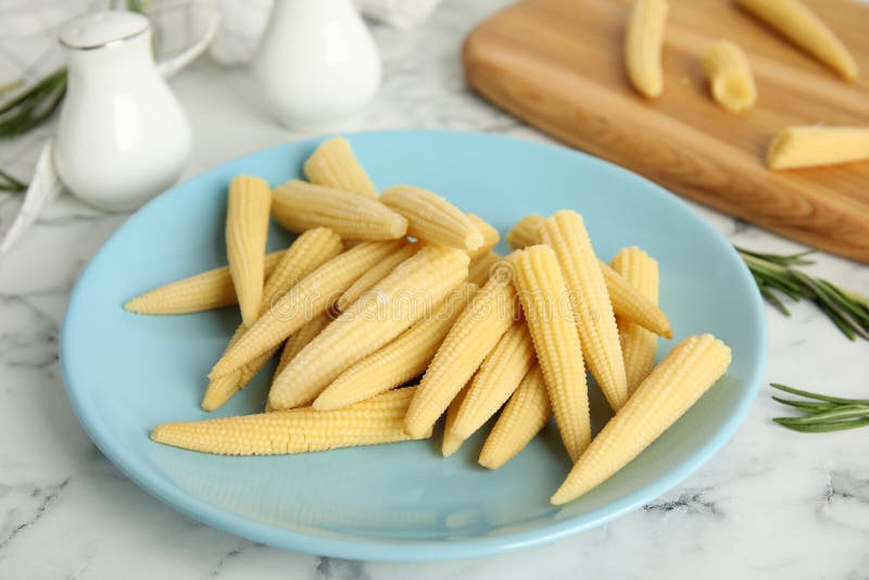 Fresh Baby Corn Cobs on White Marble Table Stock Photo - Image of ...