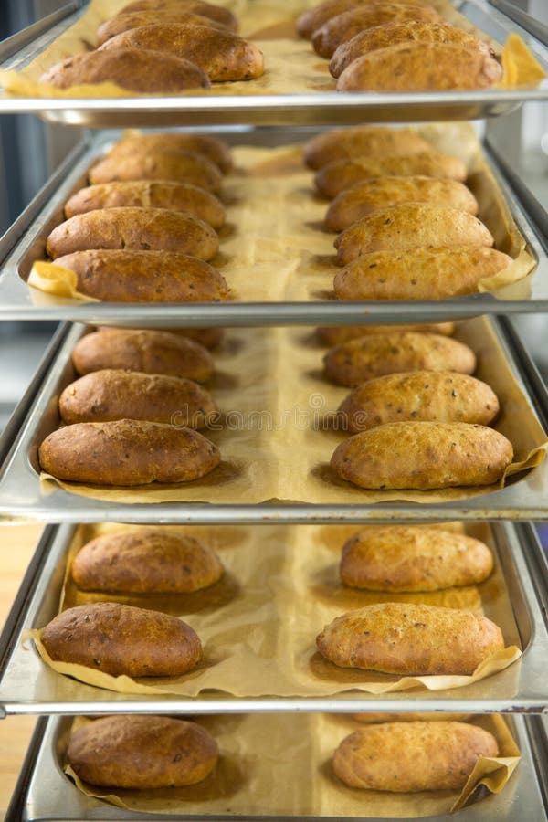 Fresh Baked Bread in Tray Rack in Stack Stock Photo - Image of display ...
