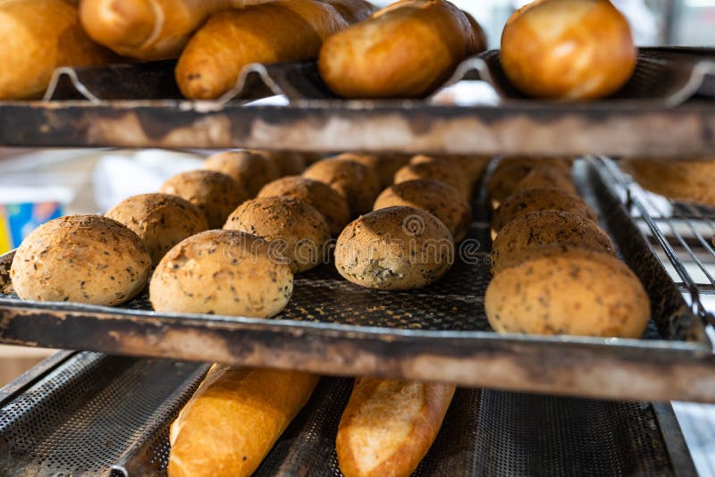 Fresh Baked Coffee Buns and Baguette Breads on Cooling Rack Stock Photo ...