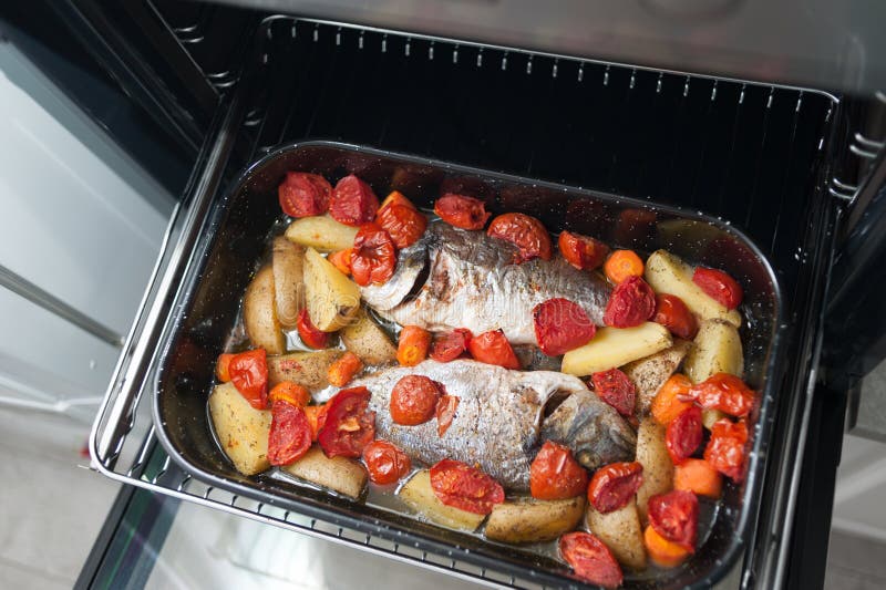 Fresh Baked Fish with Vegetables and Potatoes in Pan Stock Image ...