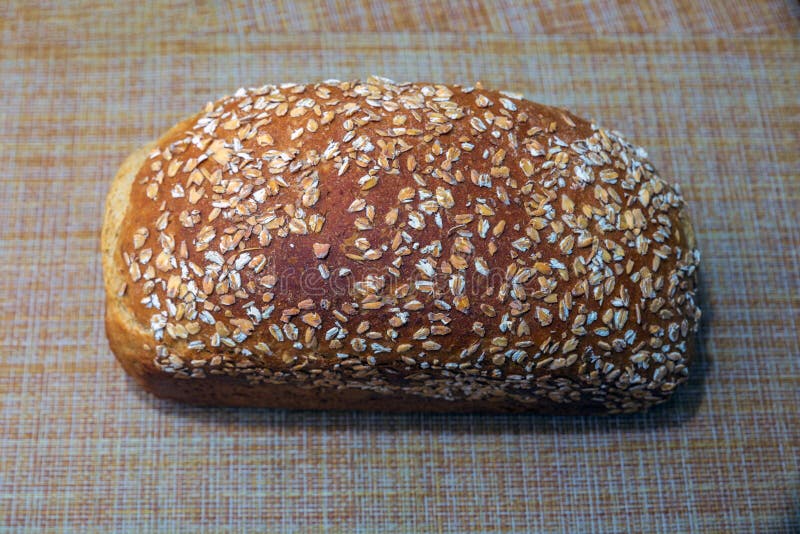 Fresh Baked Oatmeal Loaf Lies Stock Photo - Image of flakes, baked ...