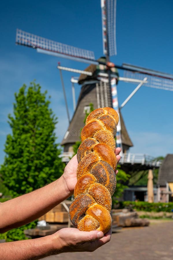 Fresh Baked Plaited Bread and Grain Wind Mill on Background, North ...