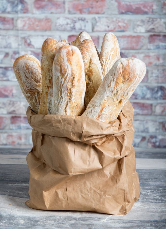 Fresh Baked Rustic Bread Loaves in Paper Bags Stock Image - Image of ...