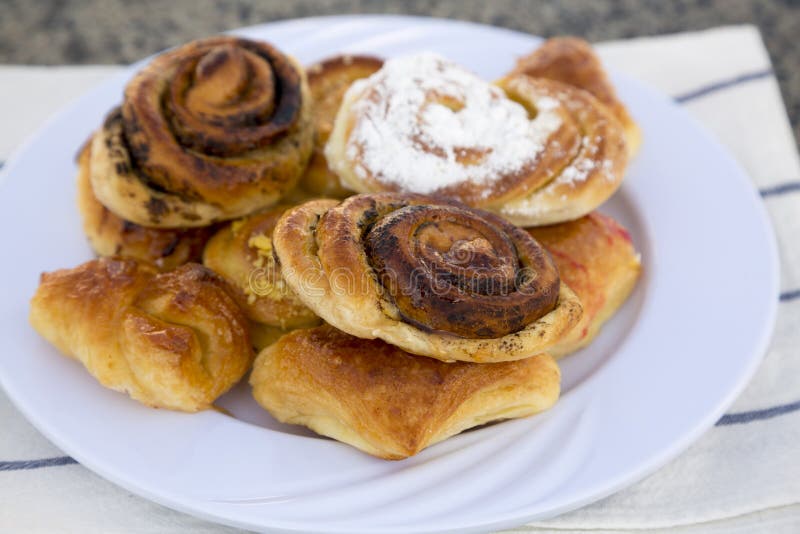 Fresh Bakery on White Plate, Side View. Close-up Stock Photo - Image of ...