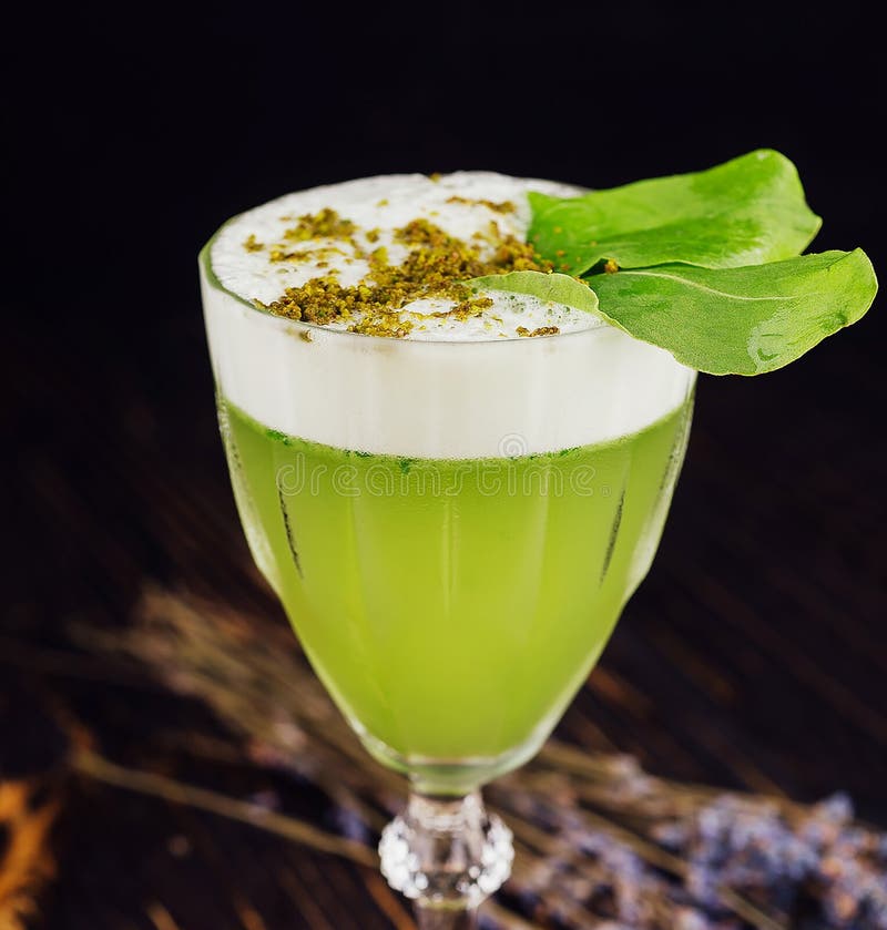 Fresh Basil Sour Cocktail with White Foam with Green Basil Leaf in a ...