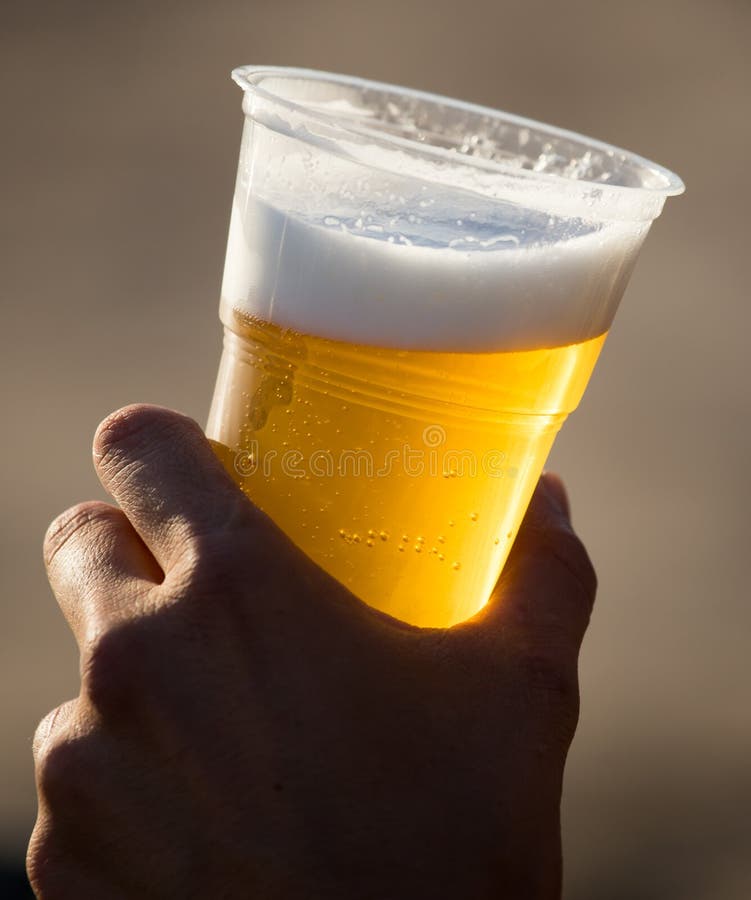 Fresh Beer in a Plastic Cup in the Hand Stock Photo - Image of pint ...