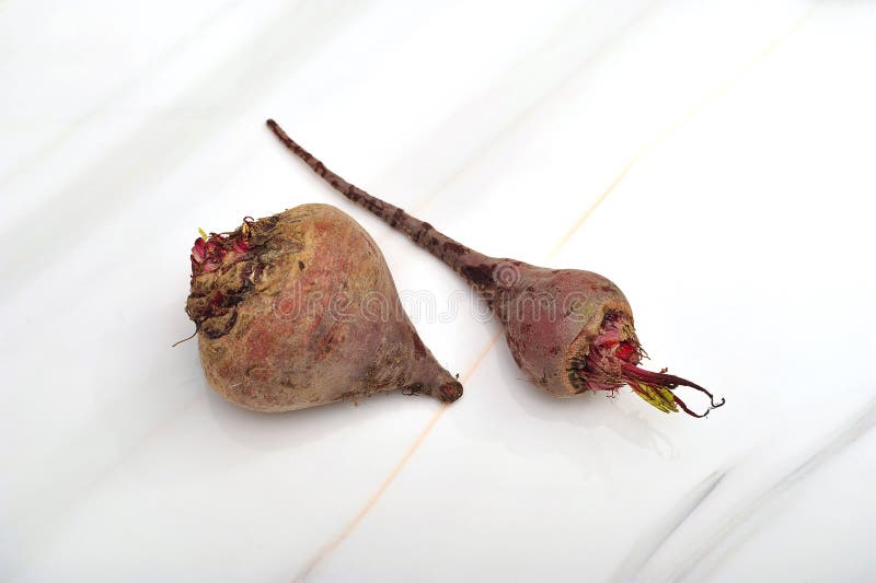 Fresh Red Beetroot with Green Leaves and Scattered Cubes, Isolated on a ...