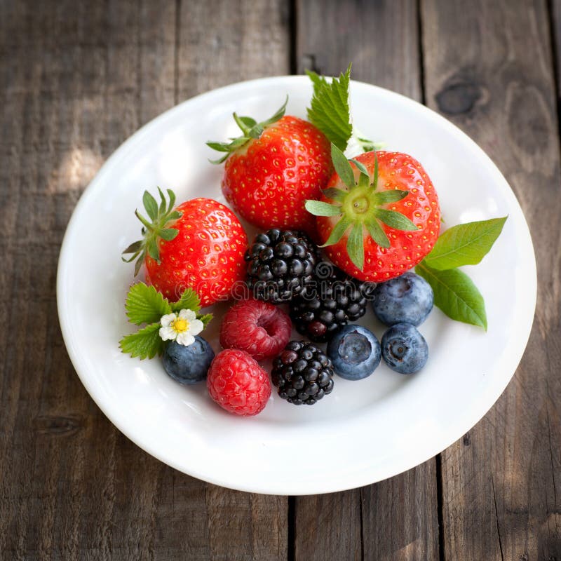 Basket of Fresh Seasonal Berries on Wooden Table, Top View Stock Image ...