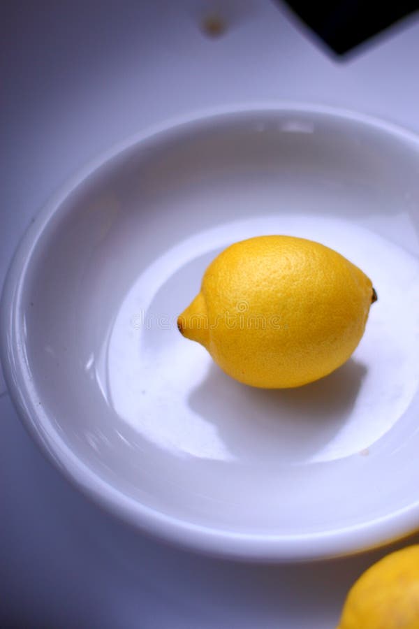 Fresh Bio Lemons on White Plate Stock Photo - Image of healthy, green ...