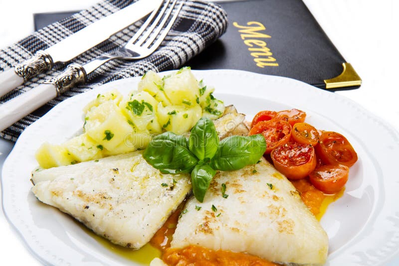 Fresh Black Cod with Potatoes and Tomatoes Sauce Stock Photo - Image of ...
