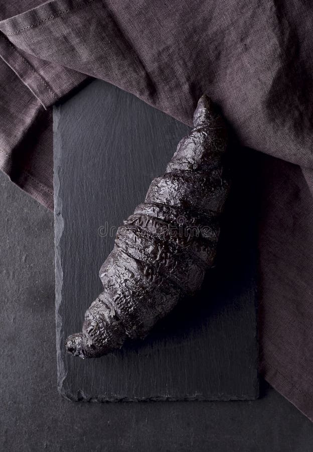 Fresh Black Croissant on a Black Board, Top View Stock Photo - Image of ...