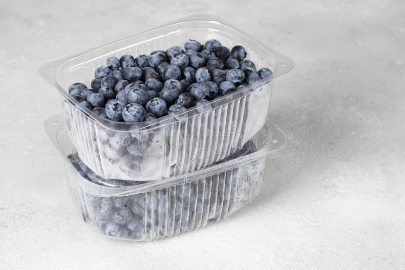 Fresh Blueberries in Plastic Containers on a Gray Background, Preparing ...