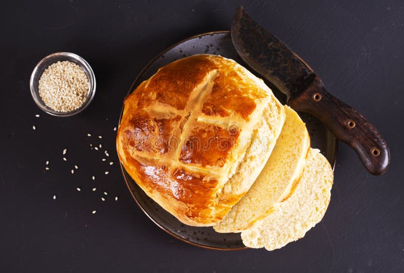 Fresh bread on black table stock photo. Image of organic - 336089660