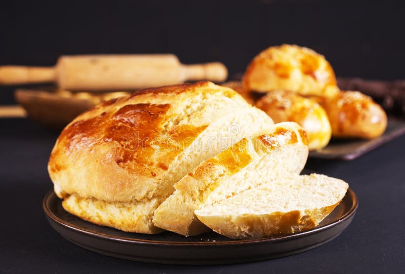 Fresh bread on black table stock photo. Image of bake - 336089682