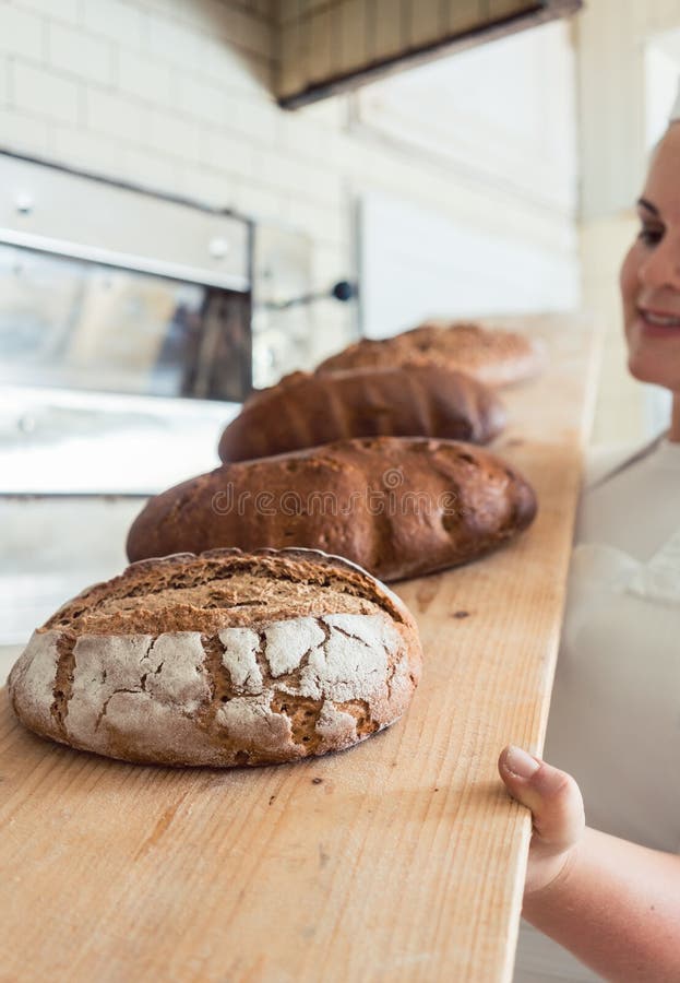 Fresh Bread on a Board in Bakehouse of Bakery Stock Image - Image of ...