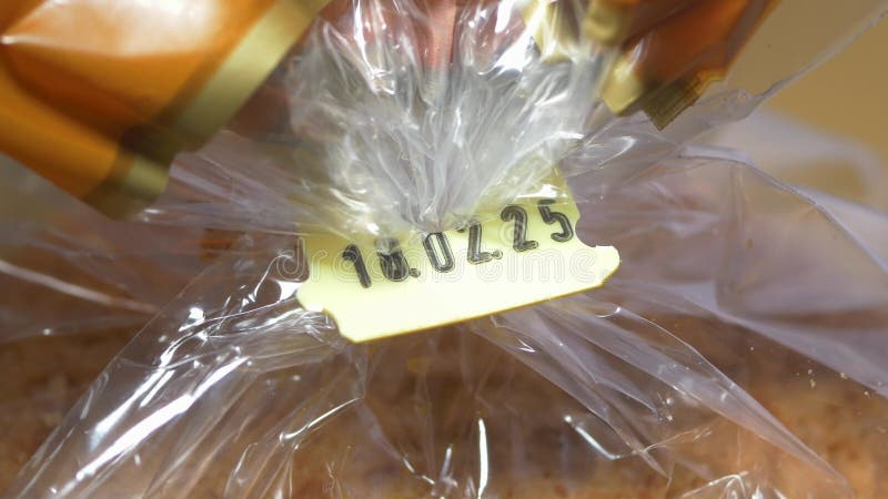 Fresh Bread Packaging Captured with a Date Label in a Bakery Stock ...