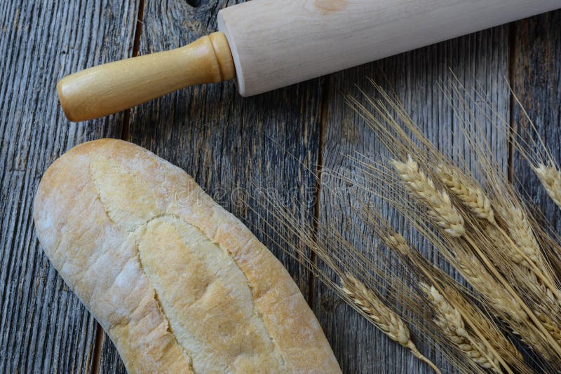 Fresh Bread with a Rolling Pin and Wheat Stock Image - Image of loaf ...