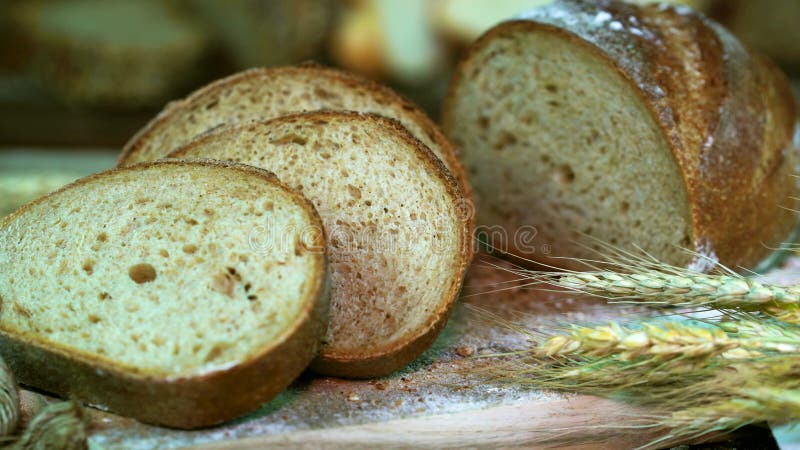 Fresh Bread Slice and Cutting Knife on Rustic Table Stock Video - Video ...