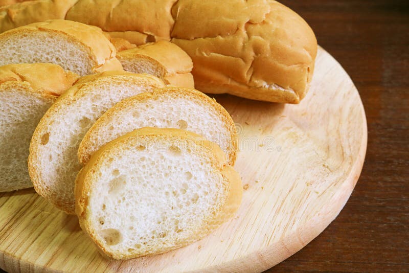 Fresh Bread Slide on Wood Cutting Board Stock Image - Image of loaf ...