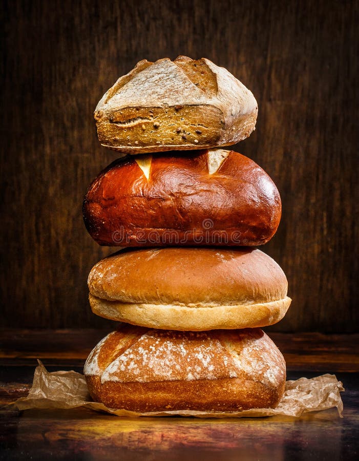 Fresh Bread on the Table. Stacked on Top of Each Other Stock Image ...