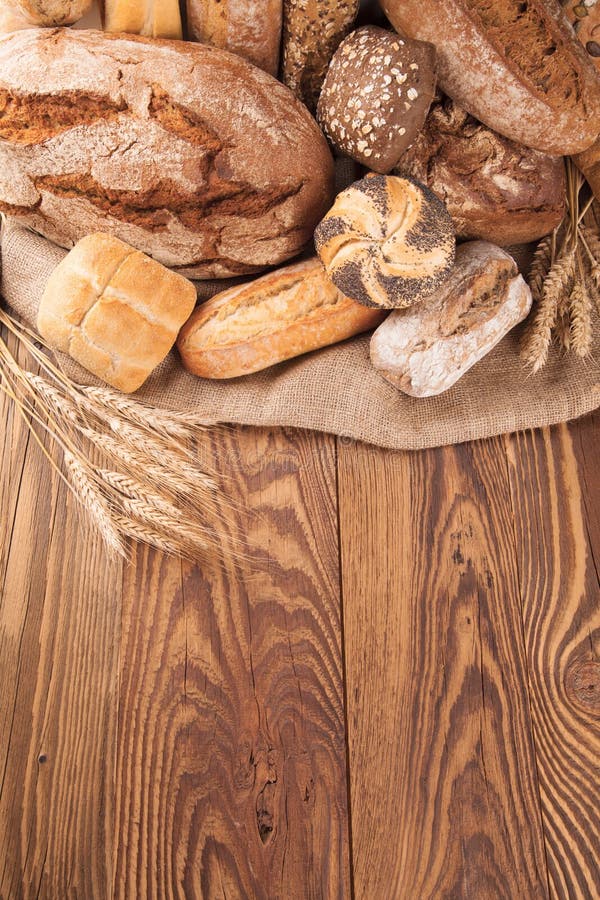 Fresh bread on wood stock image. Image of gold, bread - 33108605