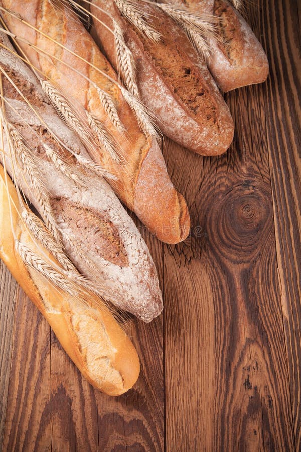 Fresh bread on wood stock image. Image of grain, loaf - 33259547