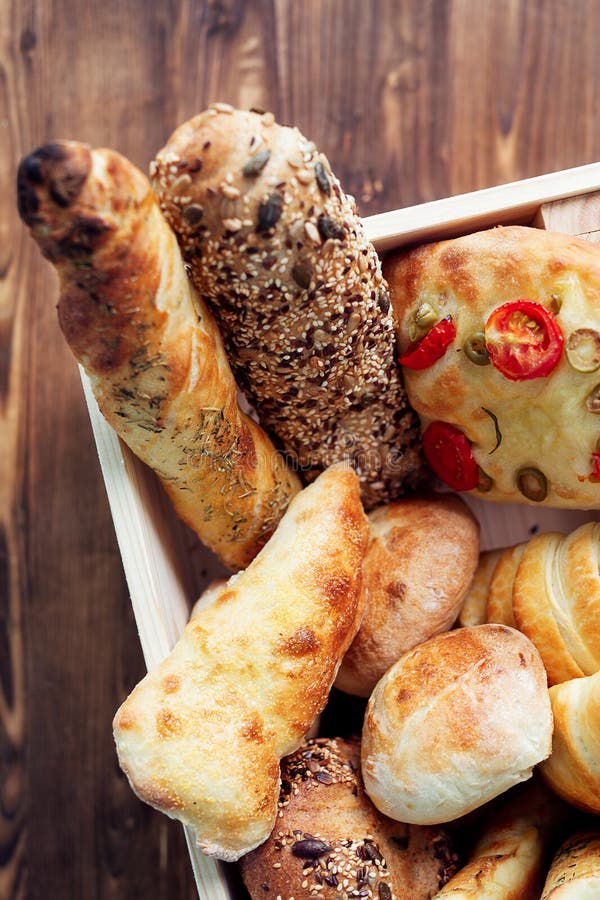 Fresh Bread on Wooden Table Stock Photo - Image of kitchen, food: 125797760