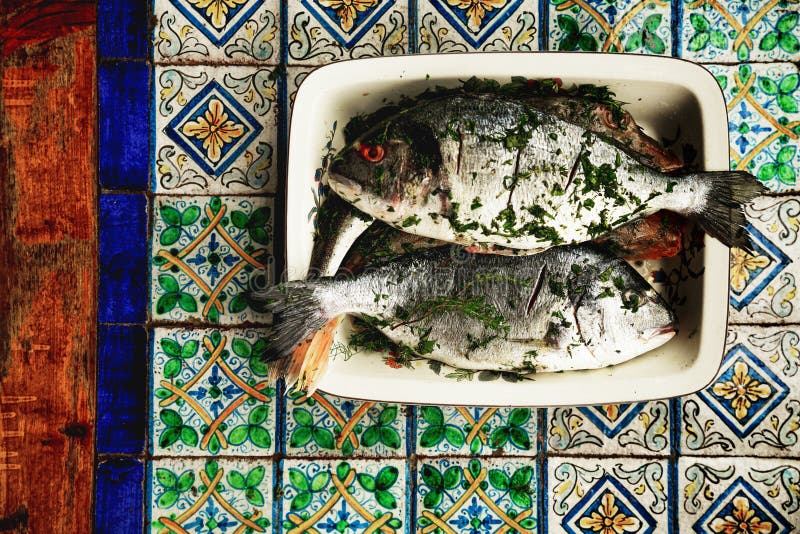 Fresh Bream Fish on the Table of Hand Painted Tiles Stock Photo - Image ...
