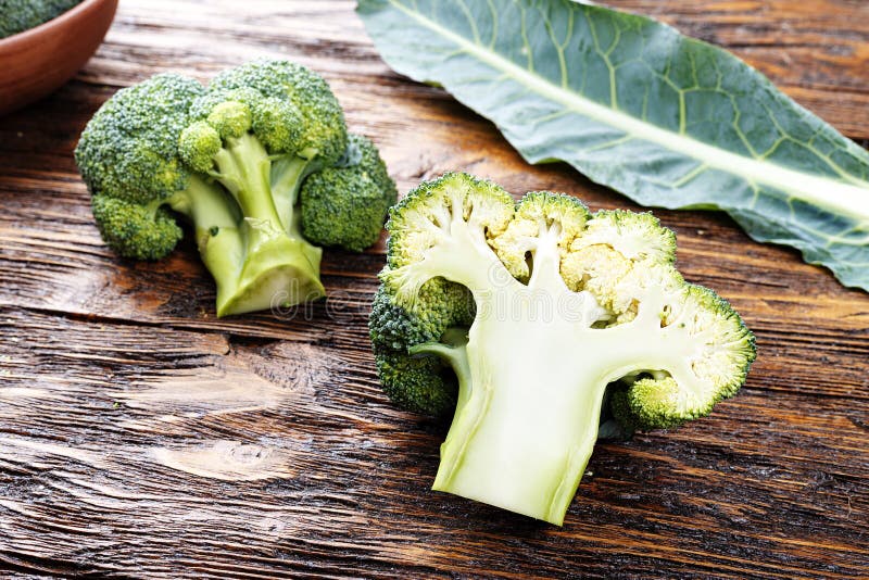 Fresh Broccoli On A Green Background Cut In Half. Stock Photo - Image ...