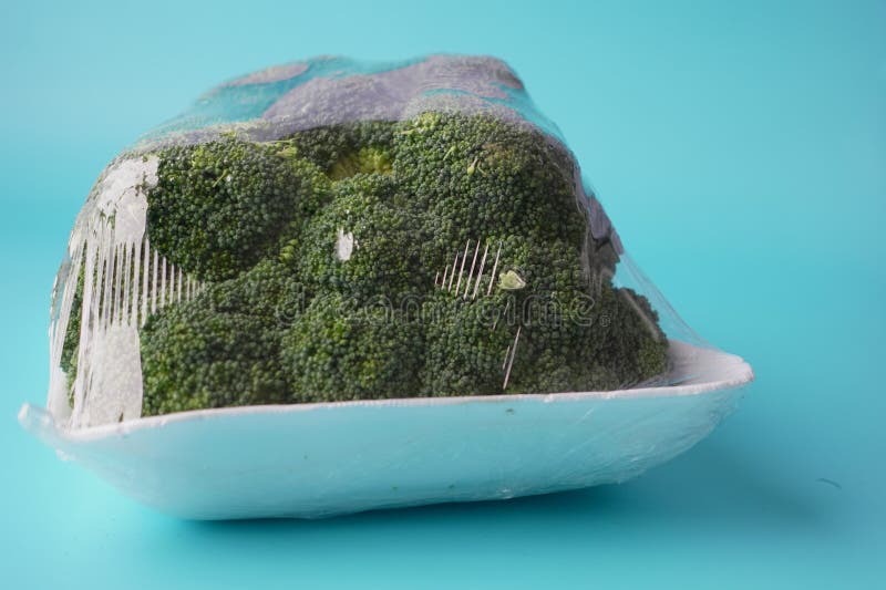 An Image of Fresh Broccoli in Packaging on a Blue Background ...