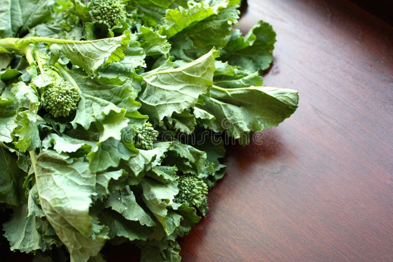 Fresh Broccoli Rabe on Wooden Surface Stock Photo - Image of cuisine ...