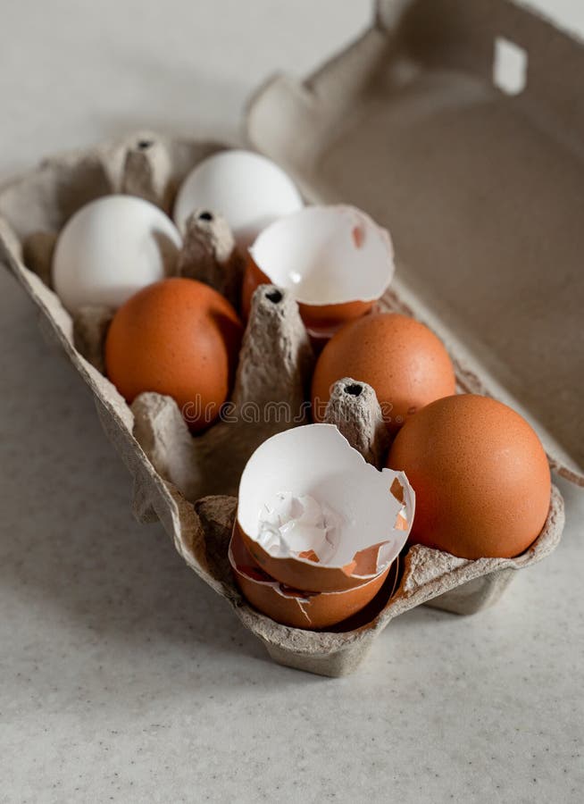 Fresh Brown and White Eggs, Empty Eggshells in Carton on Tabletop ...