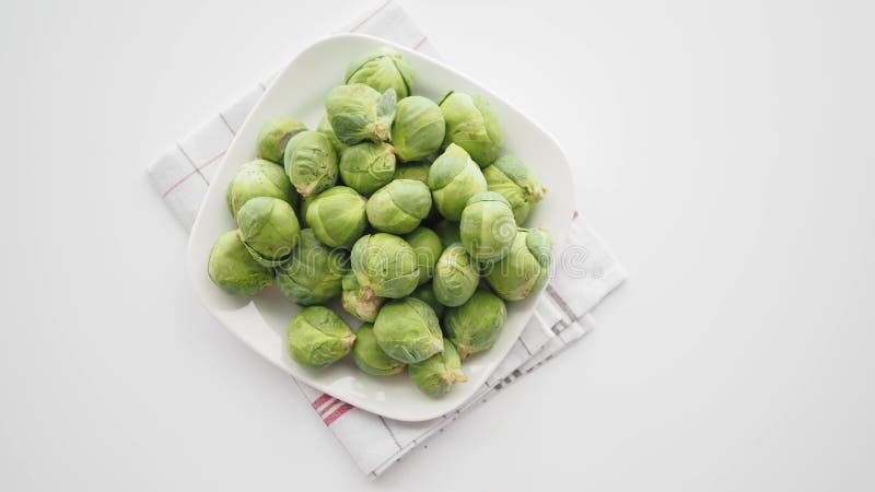Fresh Brussels Sprouts in a Box on a White Background Stock Video ...