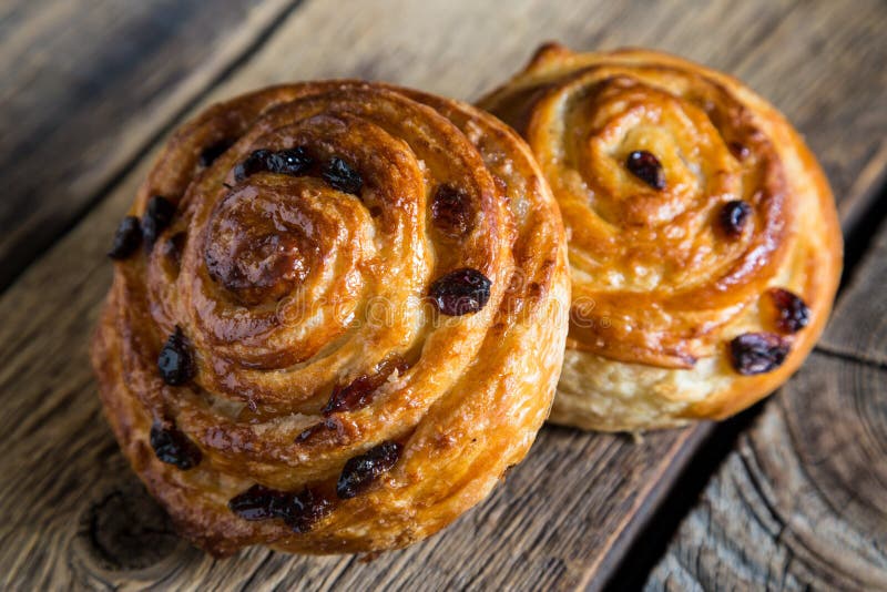 Fresh Buns with Raisins on a Wooden Table Stock Image - Image of table ...