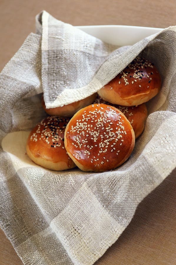 Fresh buns with sesame stock photo. Image of bakery, napkin - 58137310