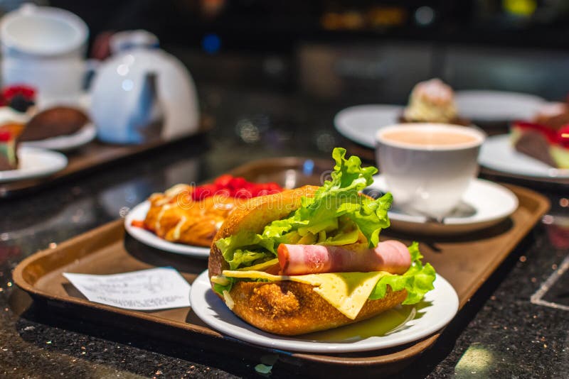 Fresh Burger with Coffee and Some Pastry in Cafe. Stock Photo - Image ...